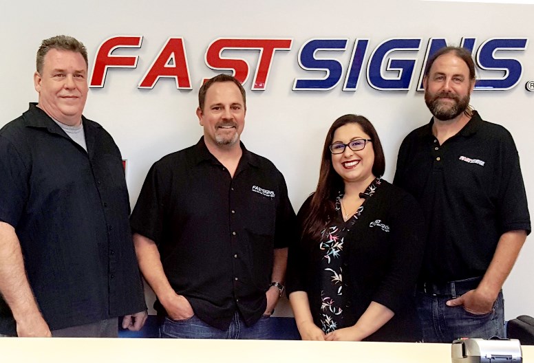 New Owners of the Daytona Beach FASTSIGNS® Celebrate Ribbon Cutting